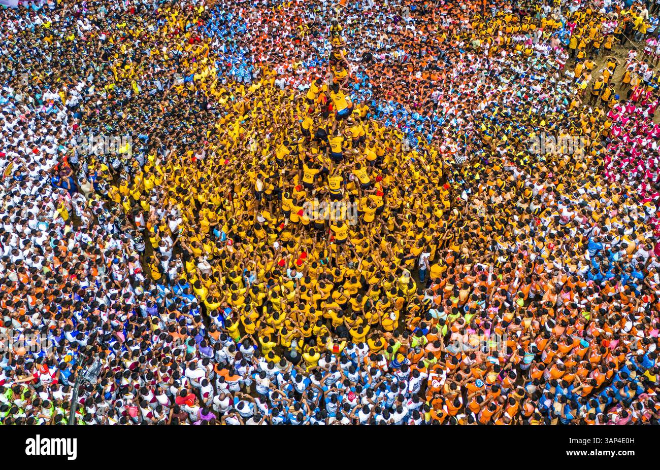 Aerial view of vibrant dahi handi festival with colorful crowd ...