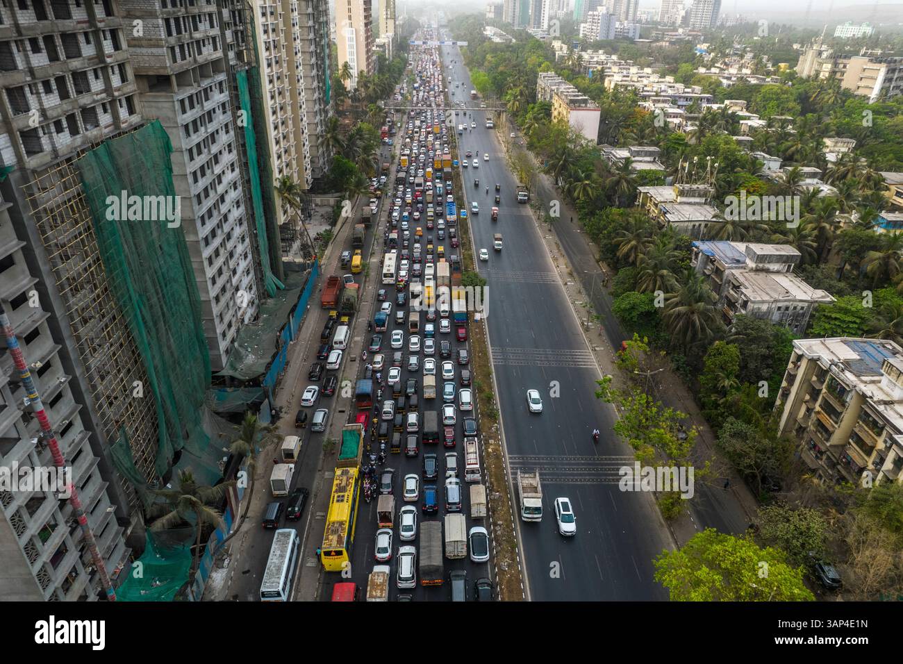 Aerial view of modern cityscape with high-rise buildings and straight ...