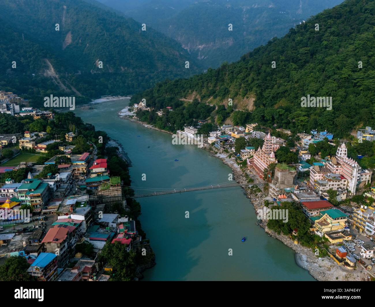 Aerial view of the serene Ganga River with the majestic Laxman Bridge ...