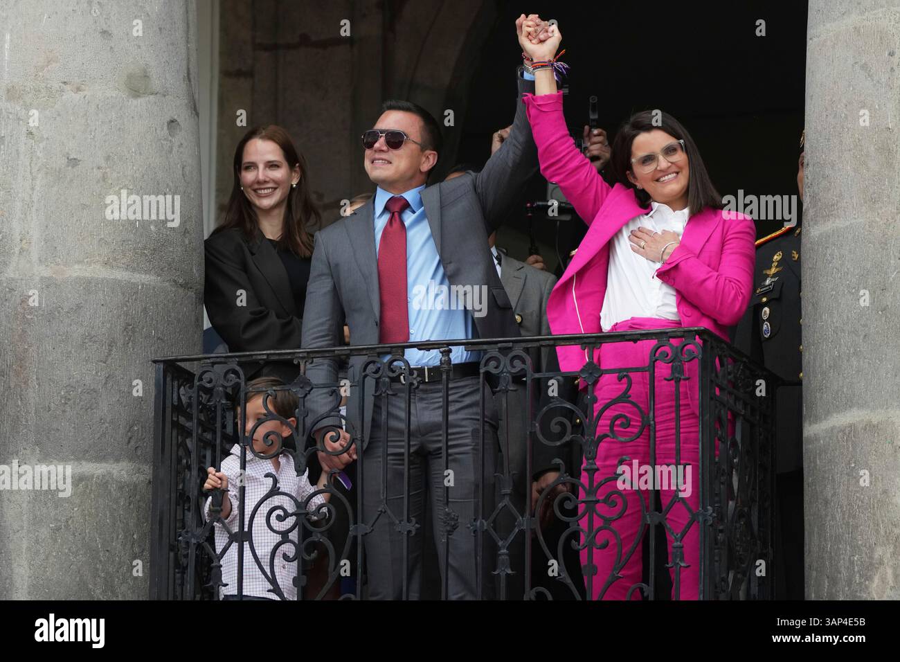 Ecuador's President Daniel Noboa holds up the hand of his Vice ...
