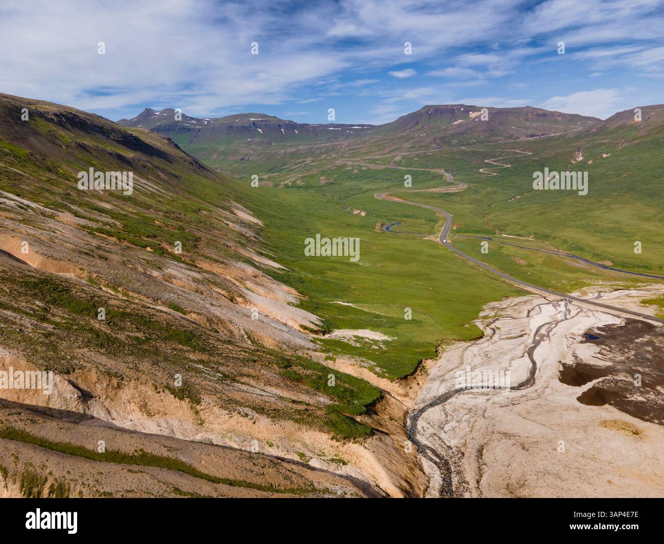 Aerial view of a breathtaking fjord with rugged mountains, serene river ...