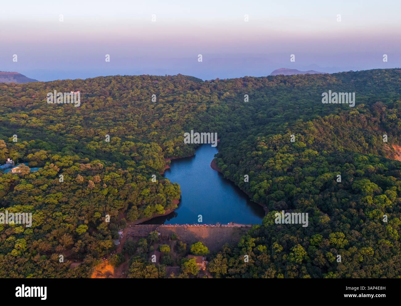 Aerial view of Charlotte lake surrounded by forest, Matheran ...