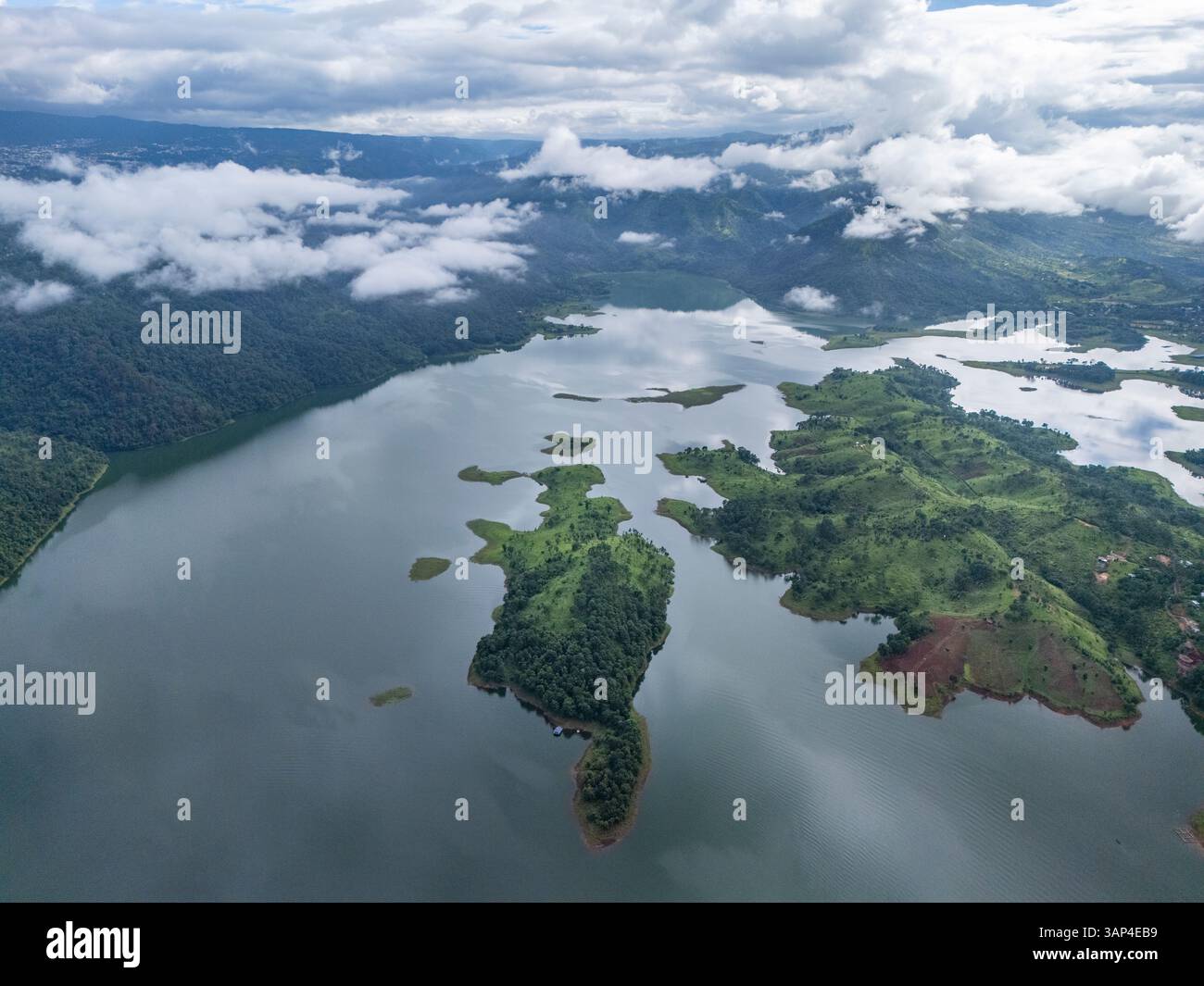 Aerial view of serene Umiam Lake surrounded by lush green forest and ...