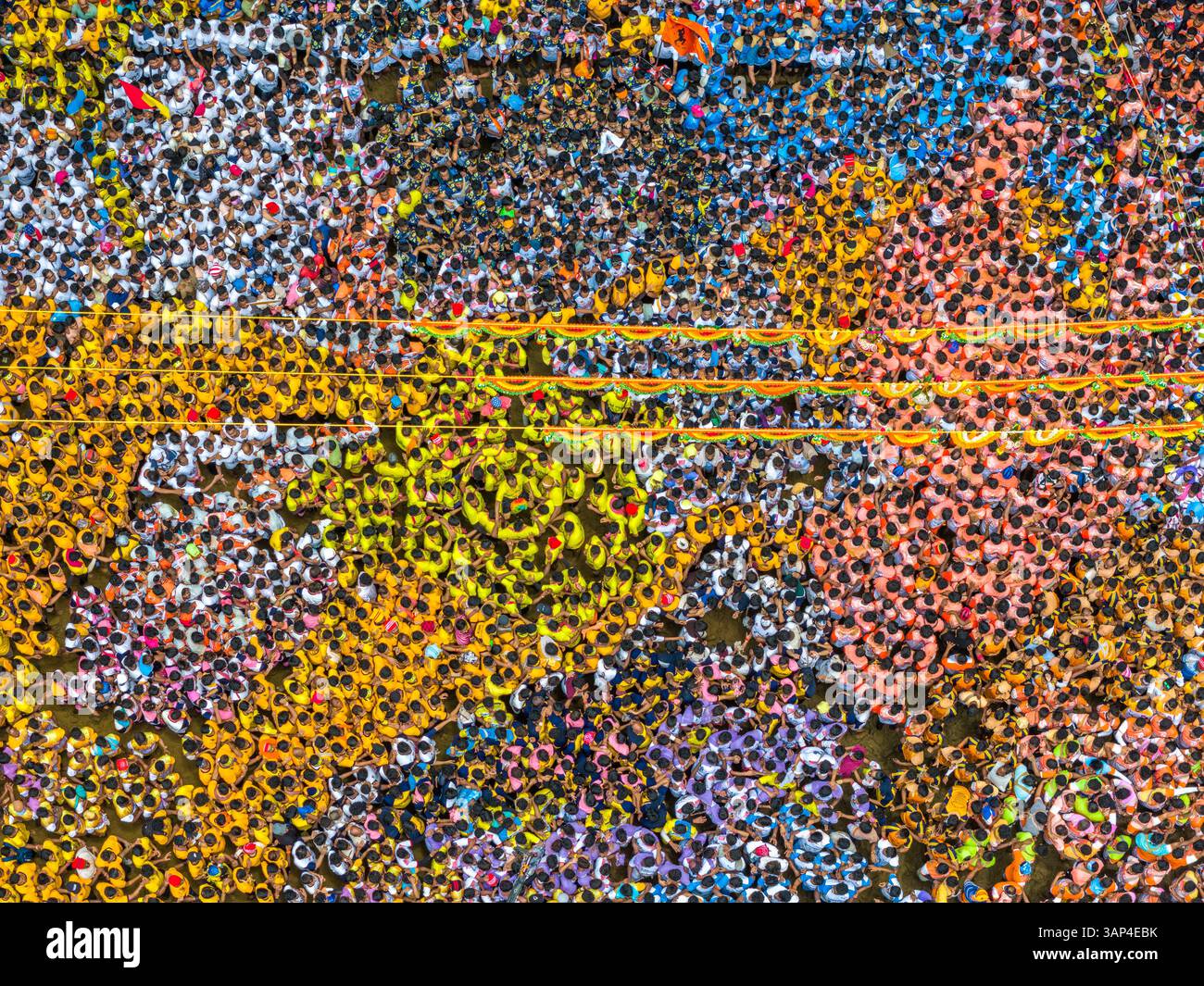 Aerial view of vibrant dahi handi festival with a colorful crowd and ...