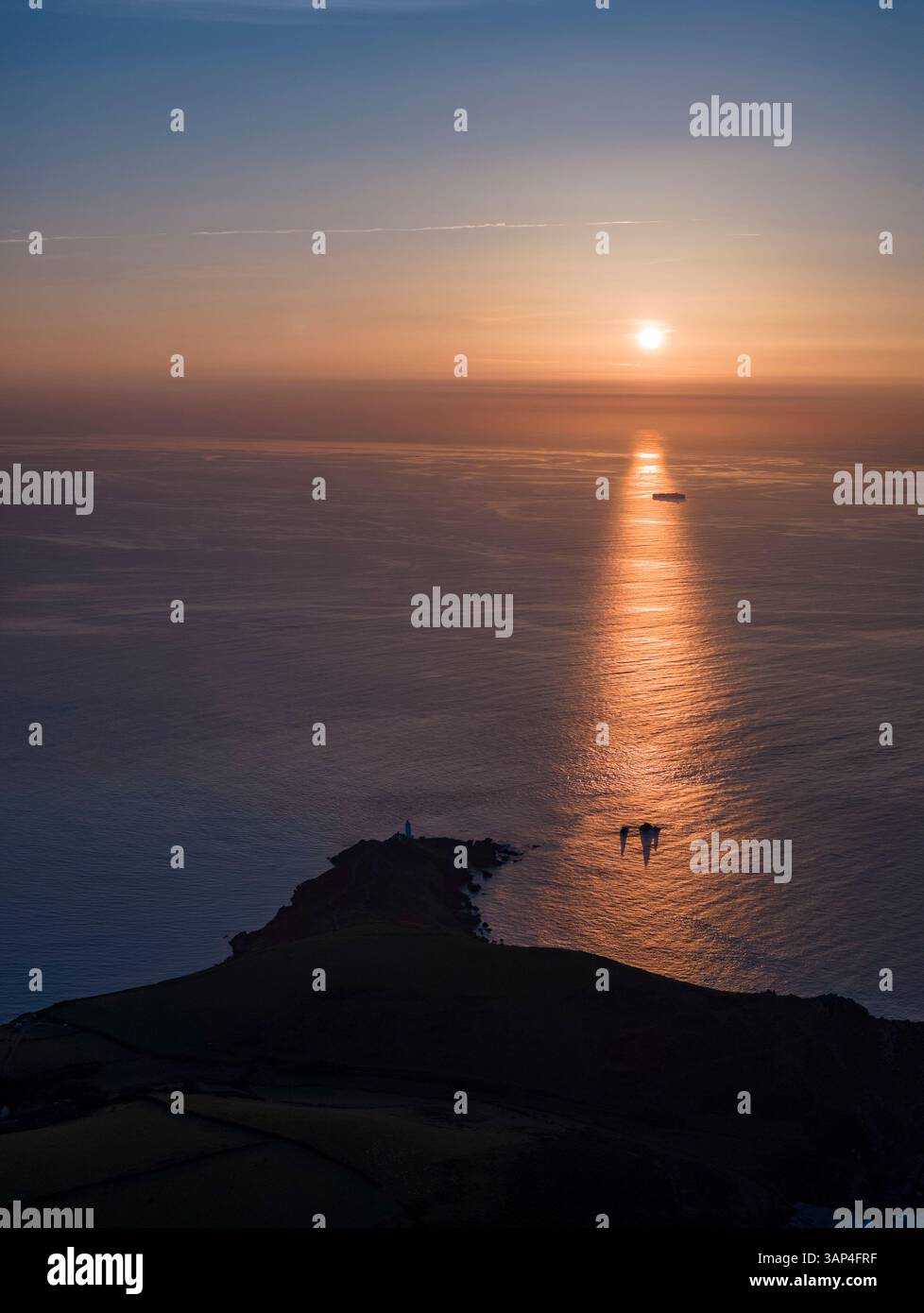 Aerial view of beautiful coastal cliffs and ocean waves at sunset ...