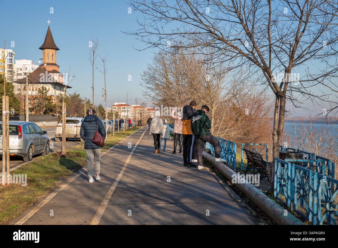 Galati, Romania - January 02, 2025: People walk along Danube embankment ...
