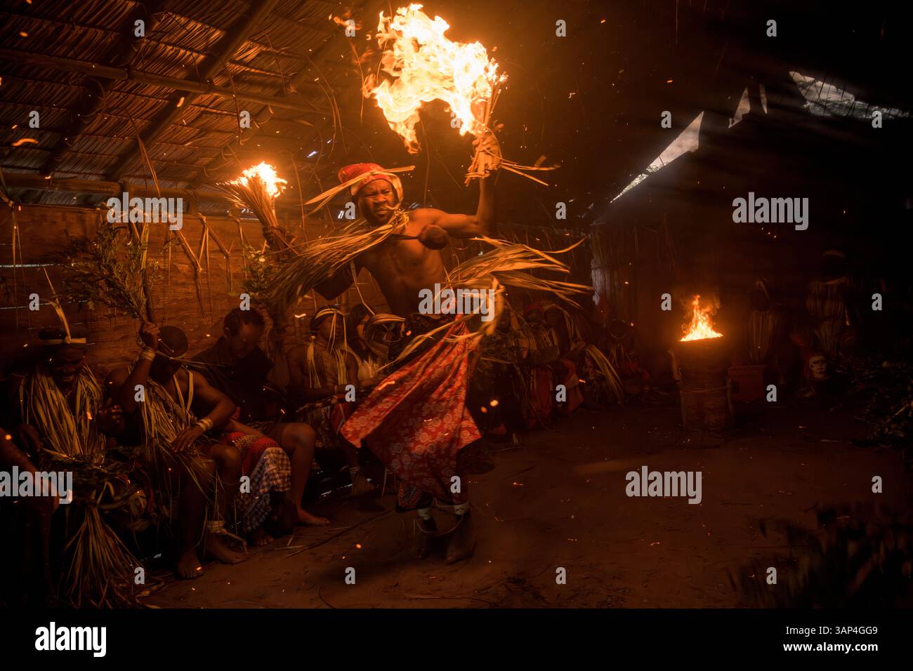 Participants in a Bwiti ceremony, dressed in ritual attire made from ...