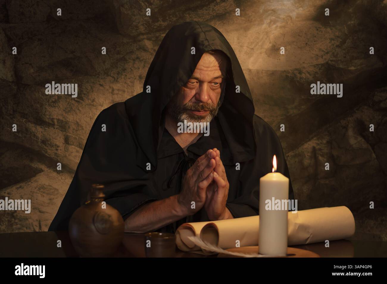 Handwriting and prayer in ancient times - a scene with a monk and ...