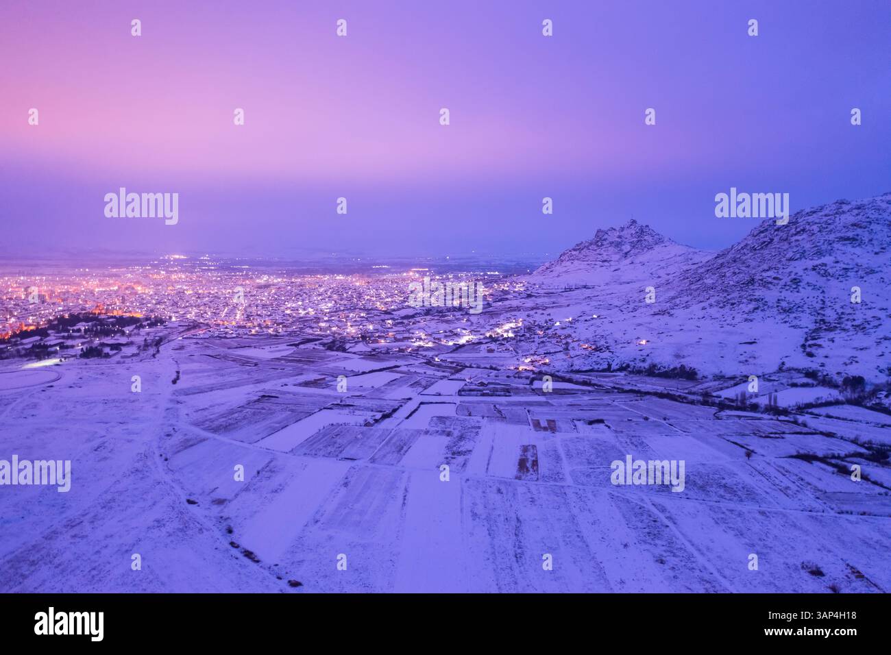 Aerial view of the lighting city Prilep in the dusk, Macedonia. The ...