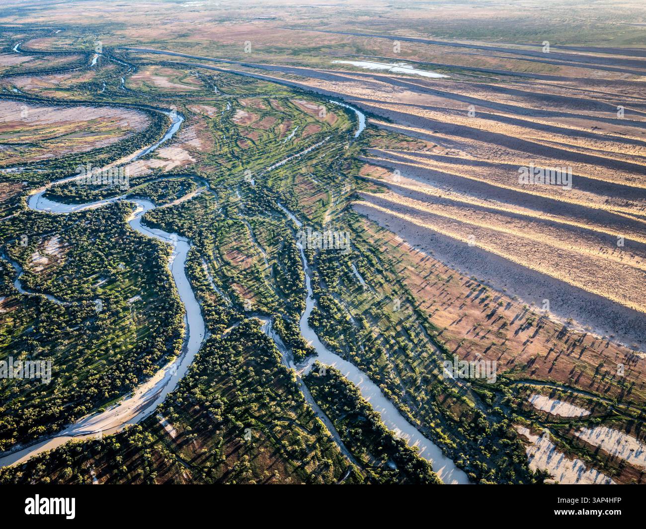 Aerial view of winding Diamantina River in flooded plain, Channel ...