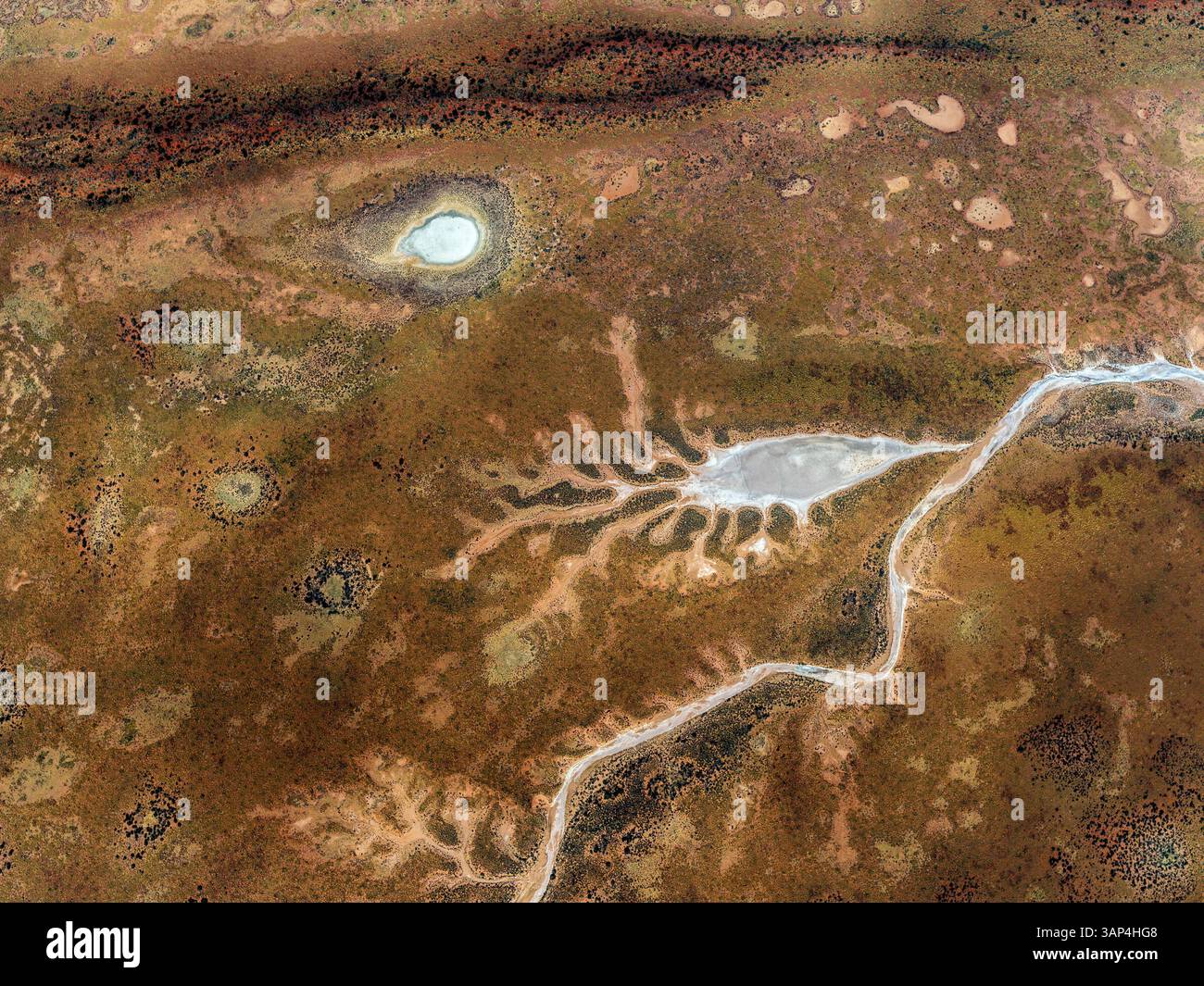 Aerial view of Lake Mackay, salt lake, desert, erosion, and rock in ...