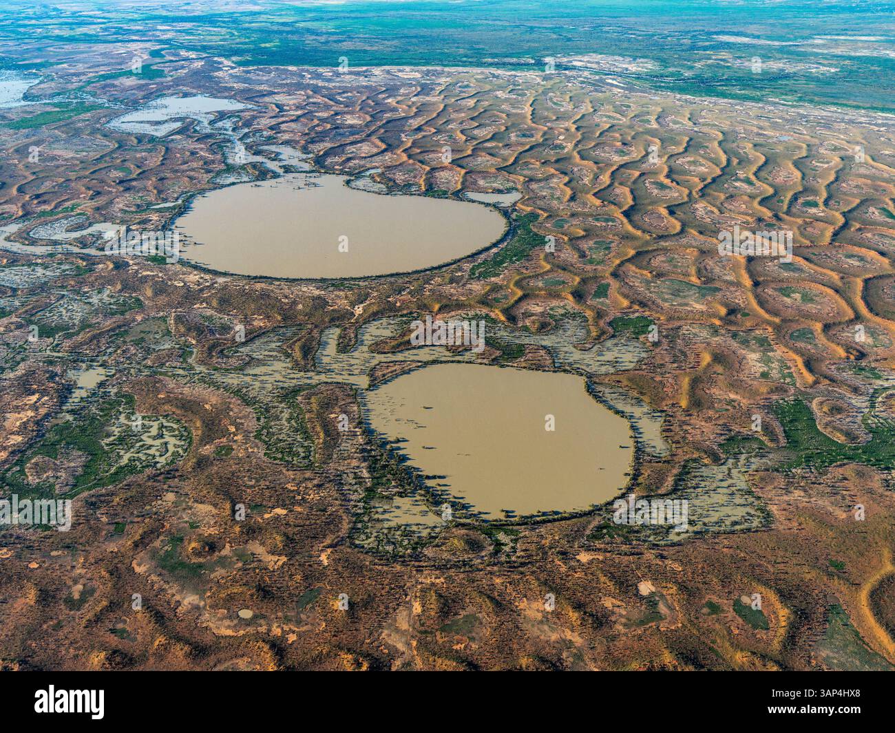Aerial view of sand dunes and water in Yamma Yamma, Queensland ...