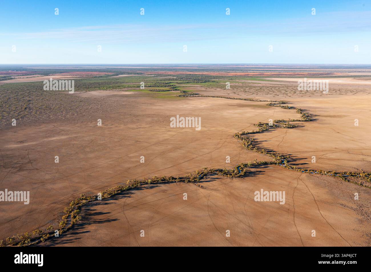 Aerial view of vast desert and winding river in Cameron Corner ...