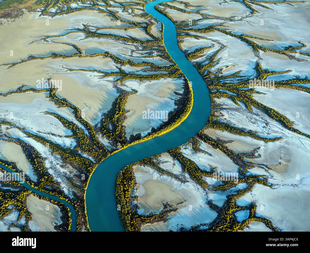 Aerial view of winding river flowing through Accident Inlet, Gulf of ...