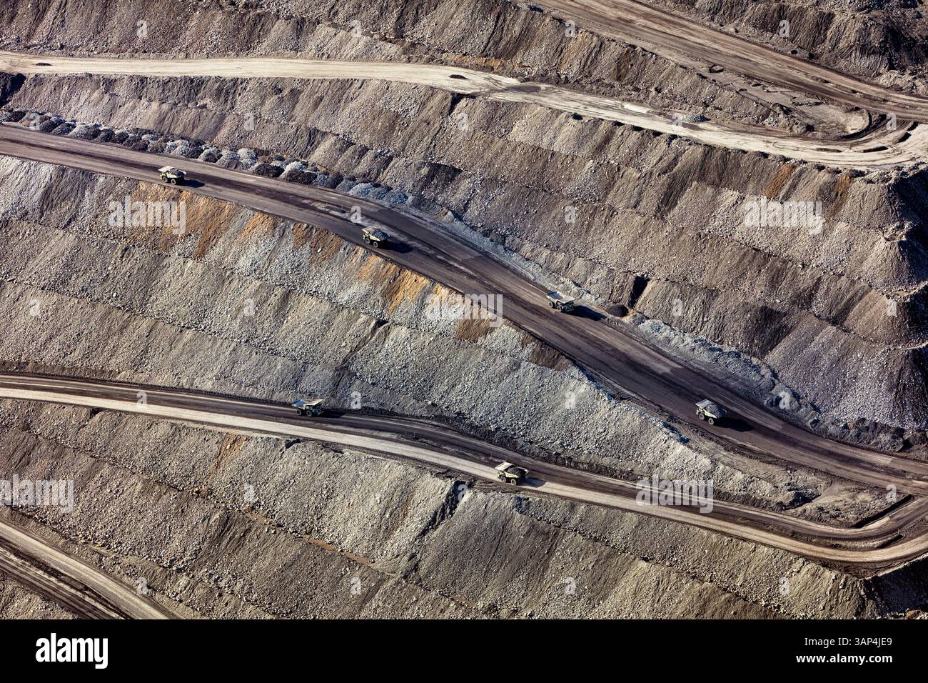 Aerial view of open cut coal mining site with roads and trucks, Mount ...