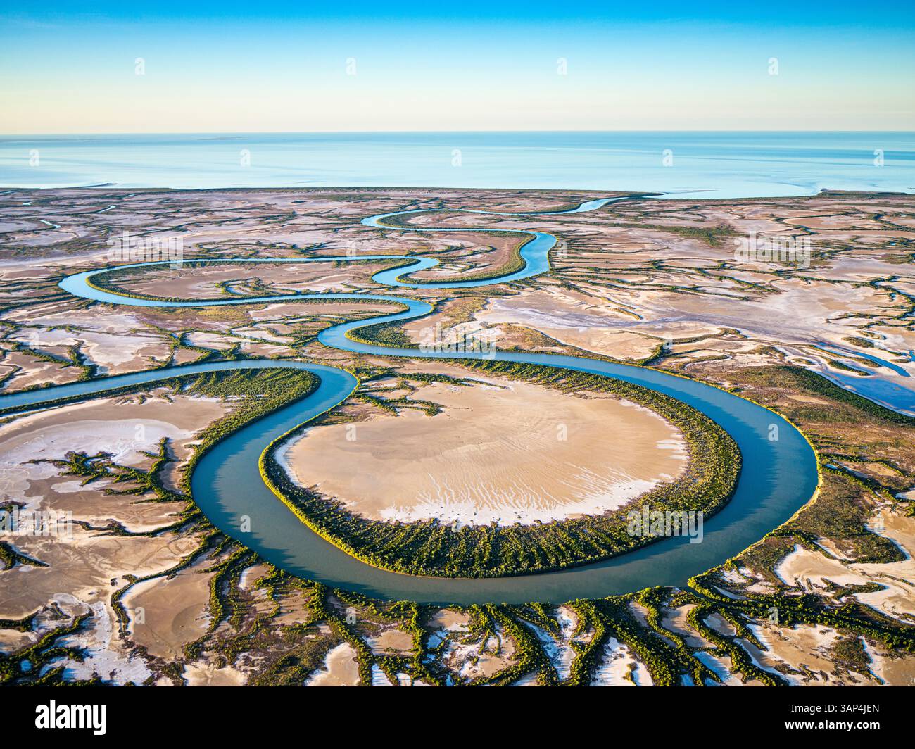 Aerial view of meandering river and wetland with sandbanks, vegetation ...