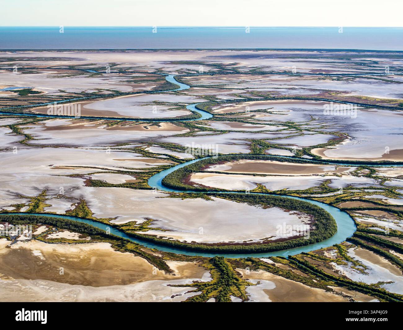 Aerial view of meandering river in Gulf of Carpentaria flood plain ...