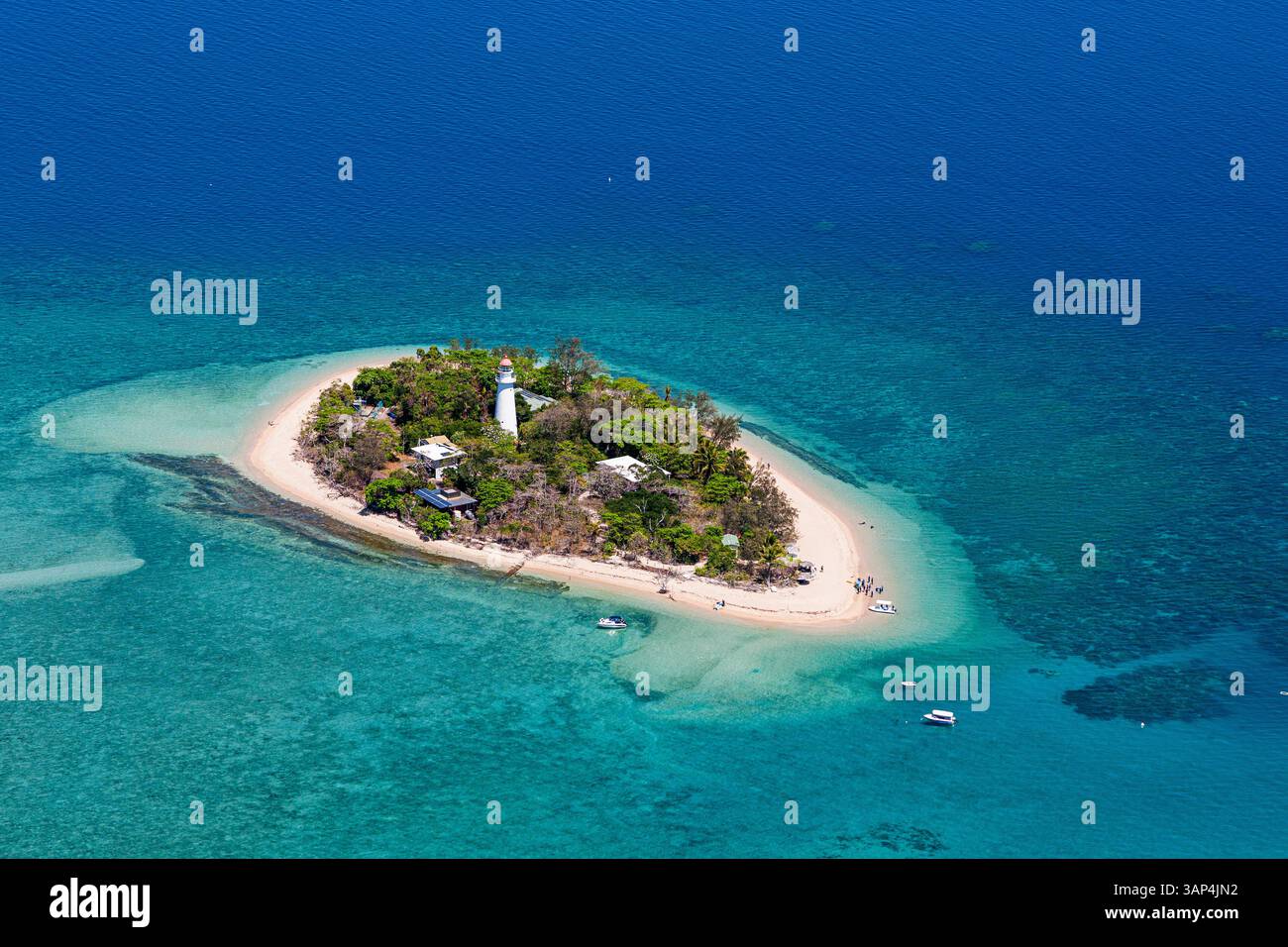 Aerial view of isolated island with turquoise water and sandy beach ...