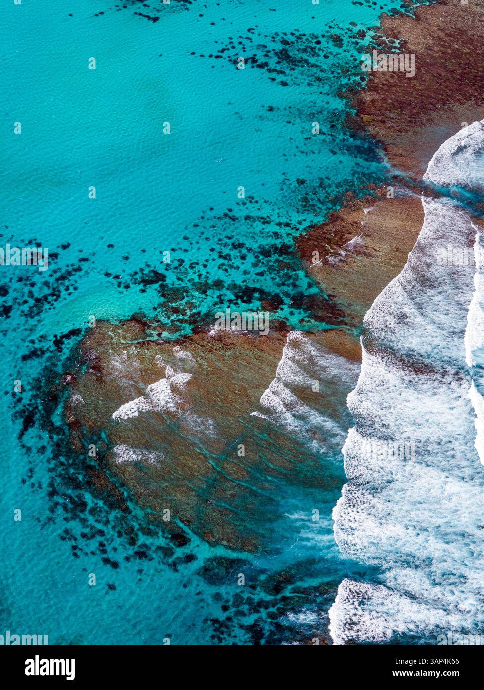 Aerial view of turquoise water and vibrant coral reef along Ningaloo ...