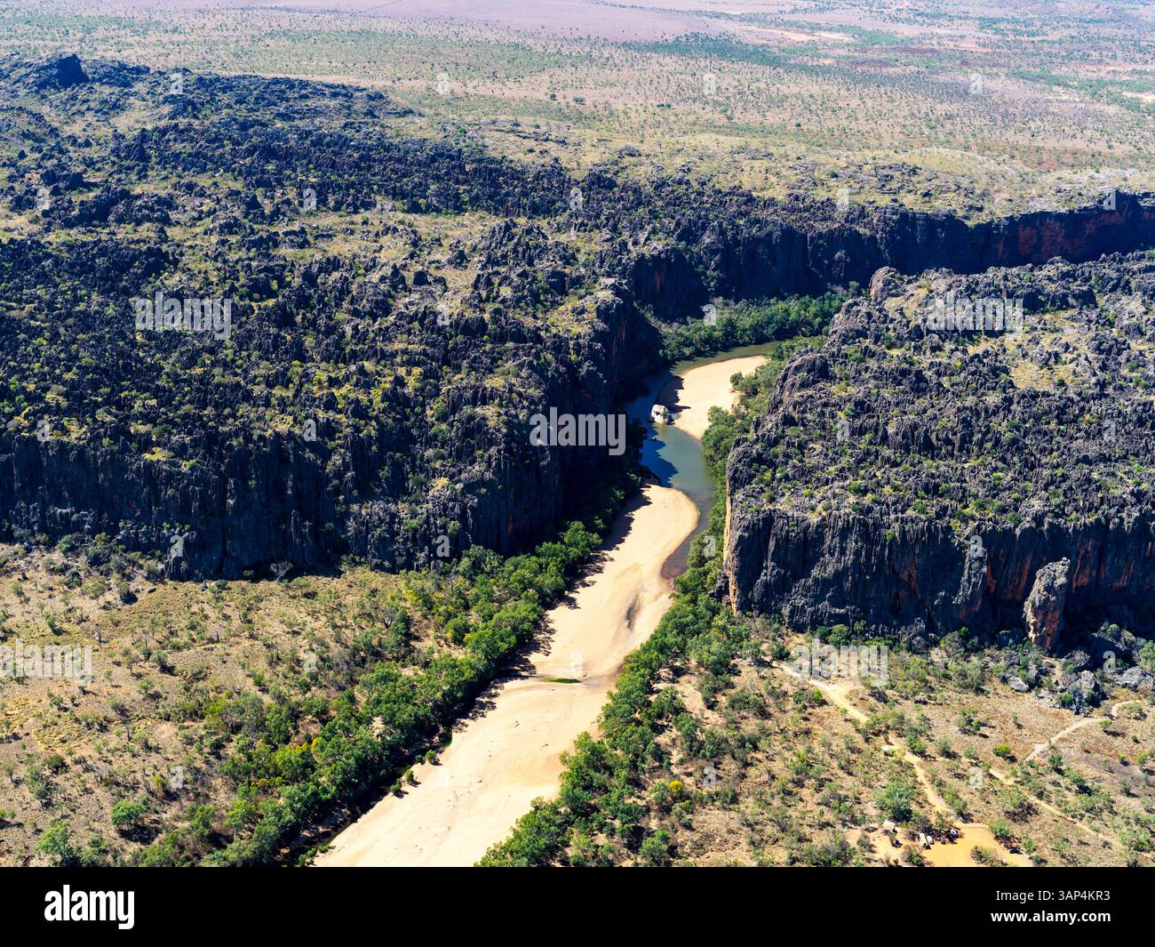 Aerial view of Windjana Gorge with river, cliff, and rock formations ...