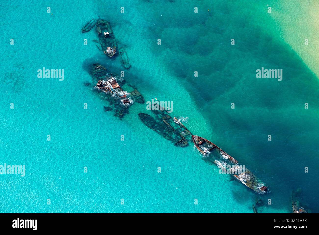 Aerial view of Tangalooma ship wrecks and clear turquoise waters ...
