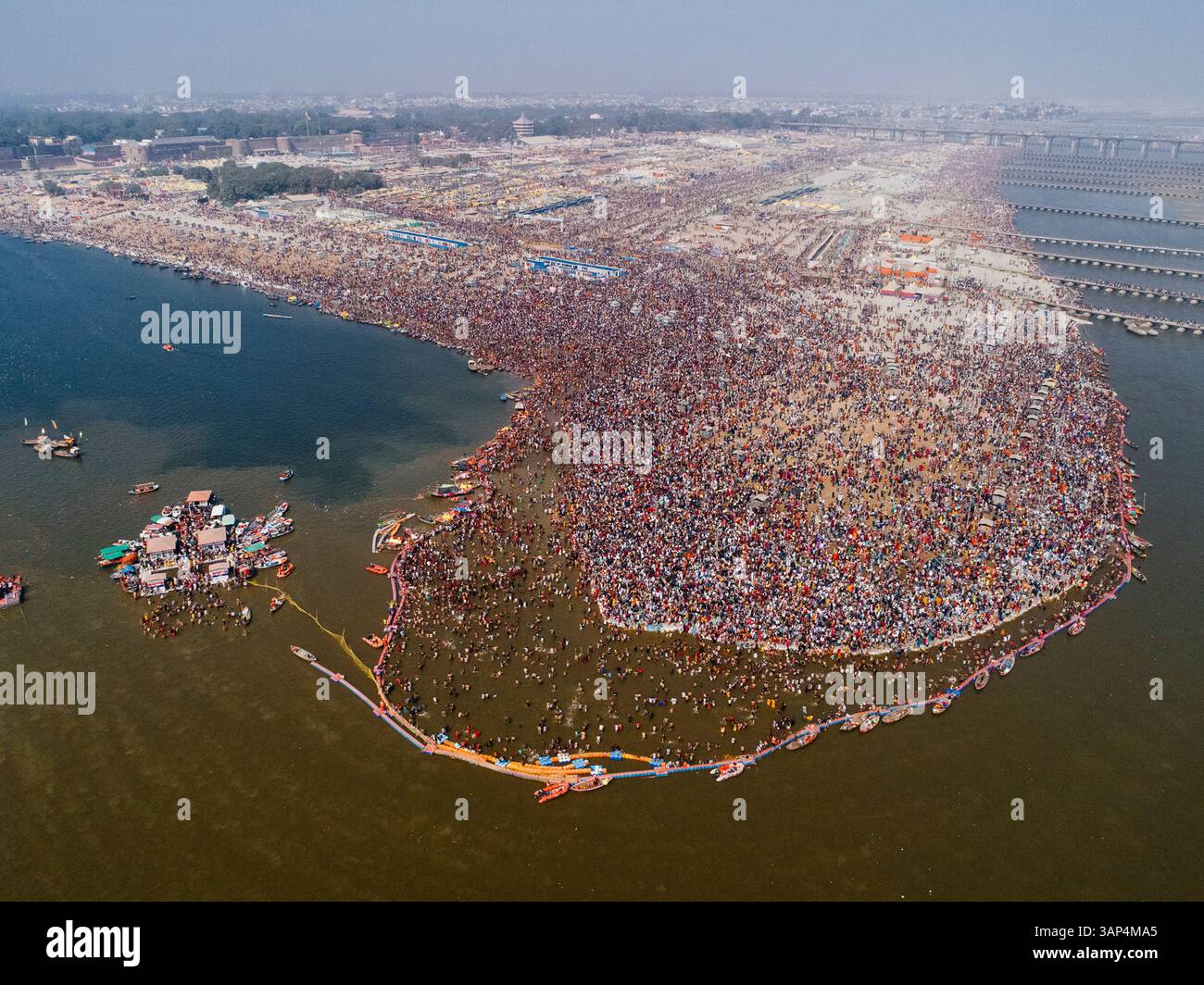 Aerial View of people gathering for Prayag Kumbh Mela along the Yamuna River, a holy festival ...