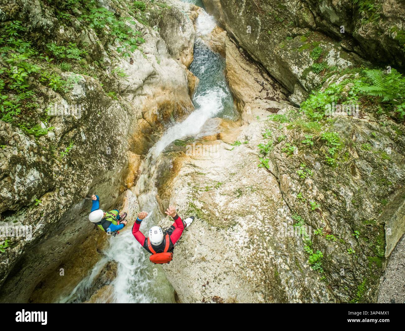 Aerial view two men canyoning Stock Photo - Alamy