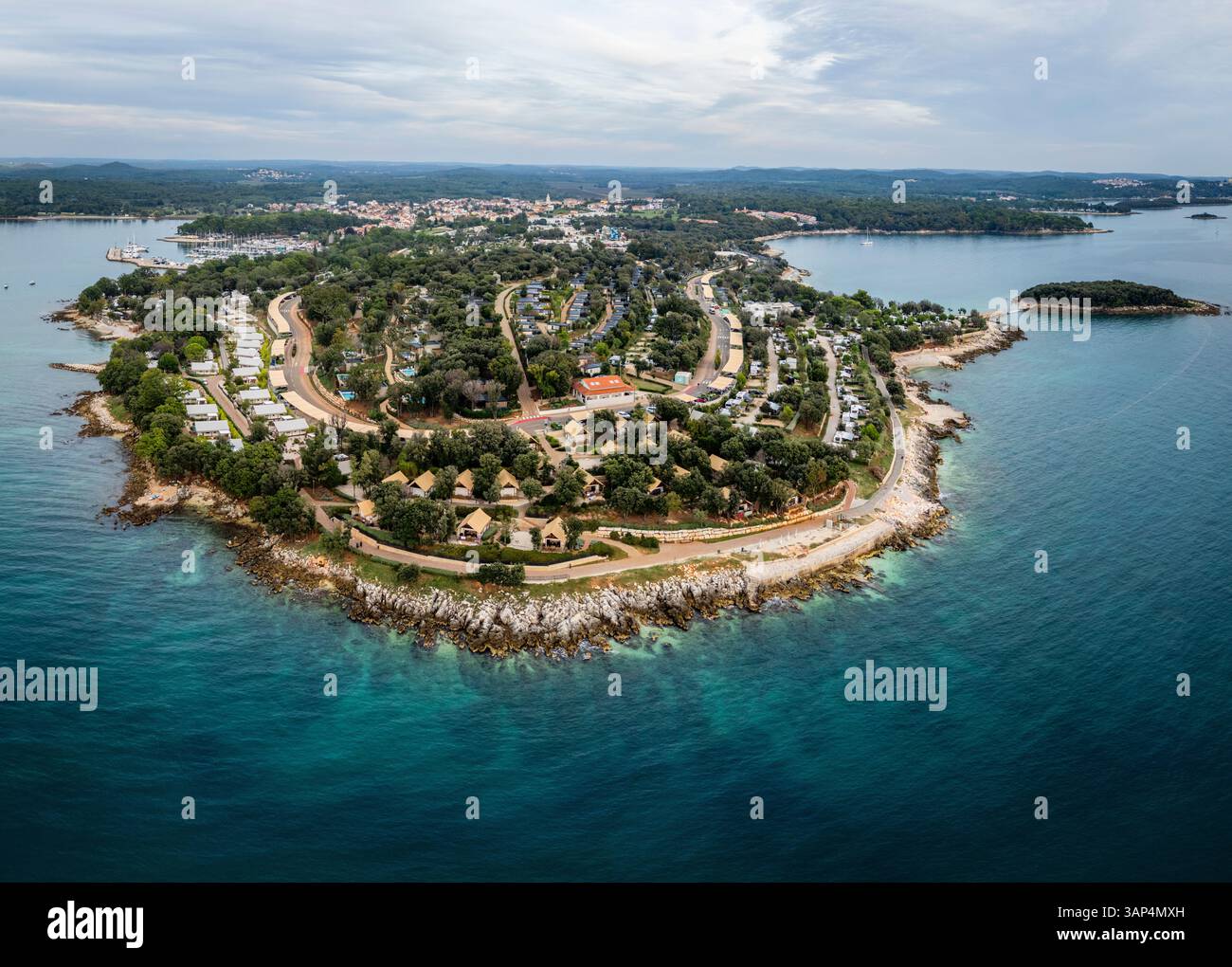 Aerial view of luxury camping resort by the tranquil coast and ...