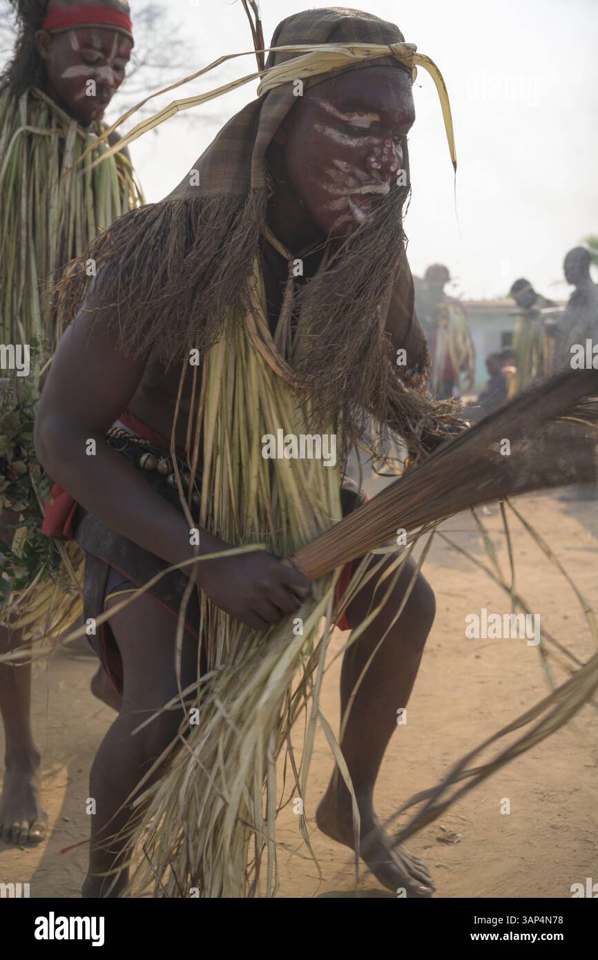 Dancers dressed in traditional ceremonial attire dancing in front of ...