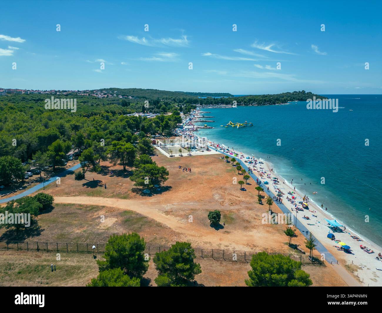 Aerial view of people on the beach relaxing at Hidrobaza park along the ...