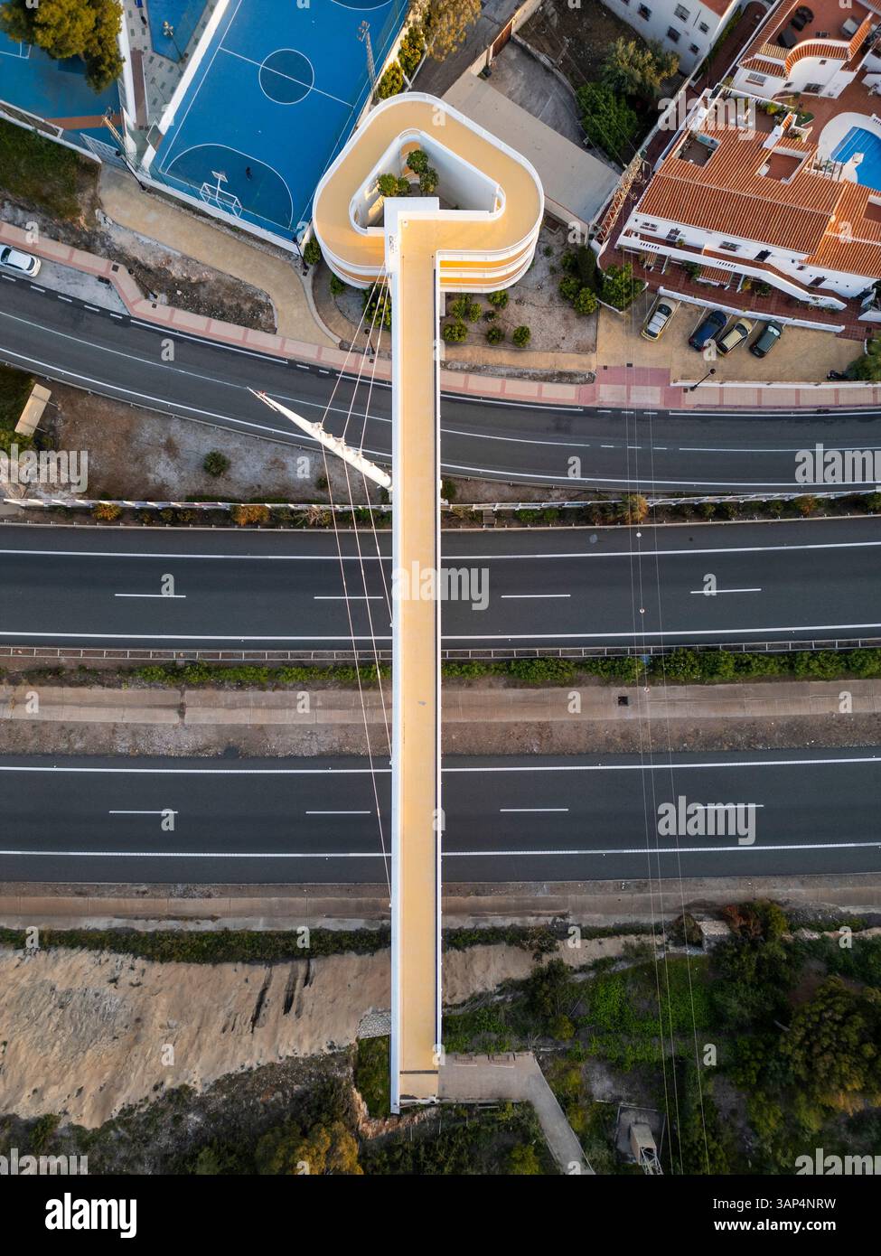 Aerial view of modern foot bridge over highway in Maro, Andalusia ...
