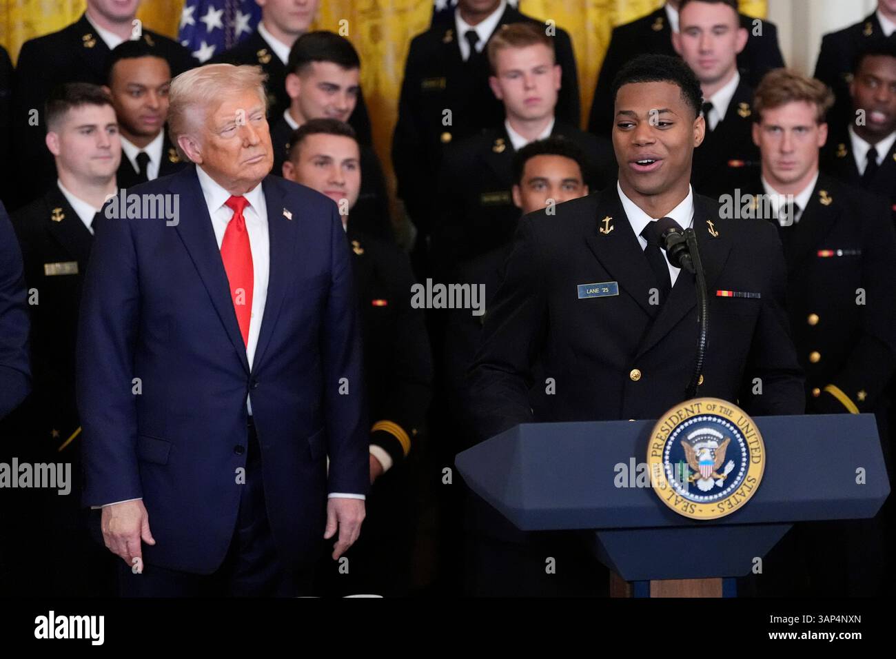 President Donald Trump listens as Rayuan Lane III speaks during the ...