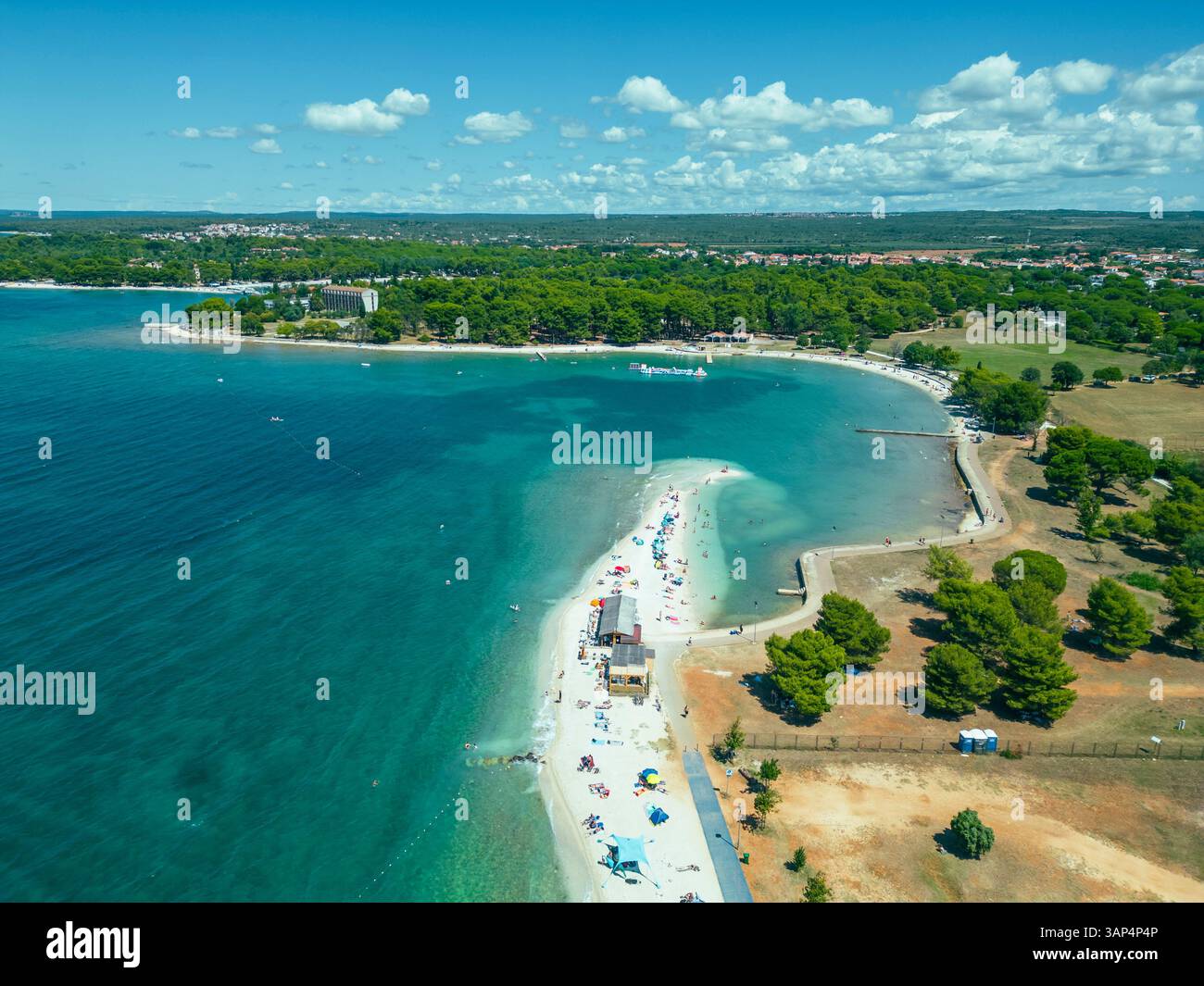 Aerial view of a small bar and restaurant with people on the beach ...