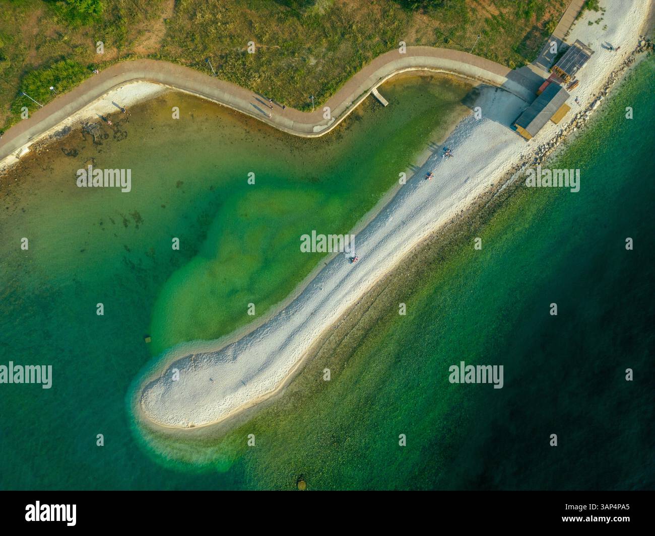 Aerial view of a small bar and restaurant on the beach along the coast ...