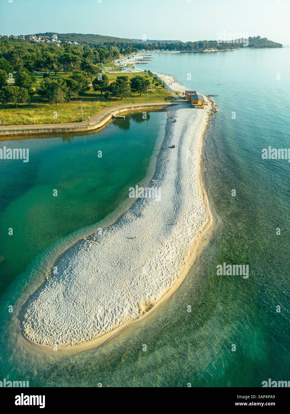 Aerial view of a small bar and restaurant on the beach along the coast ...