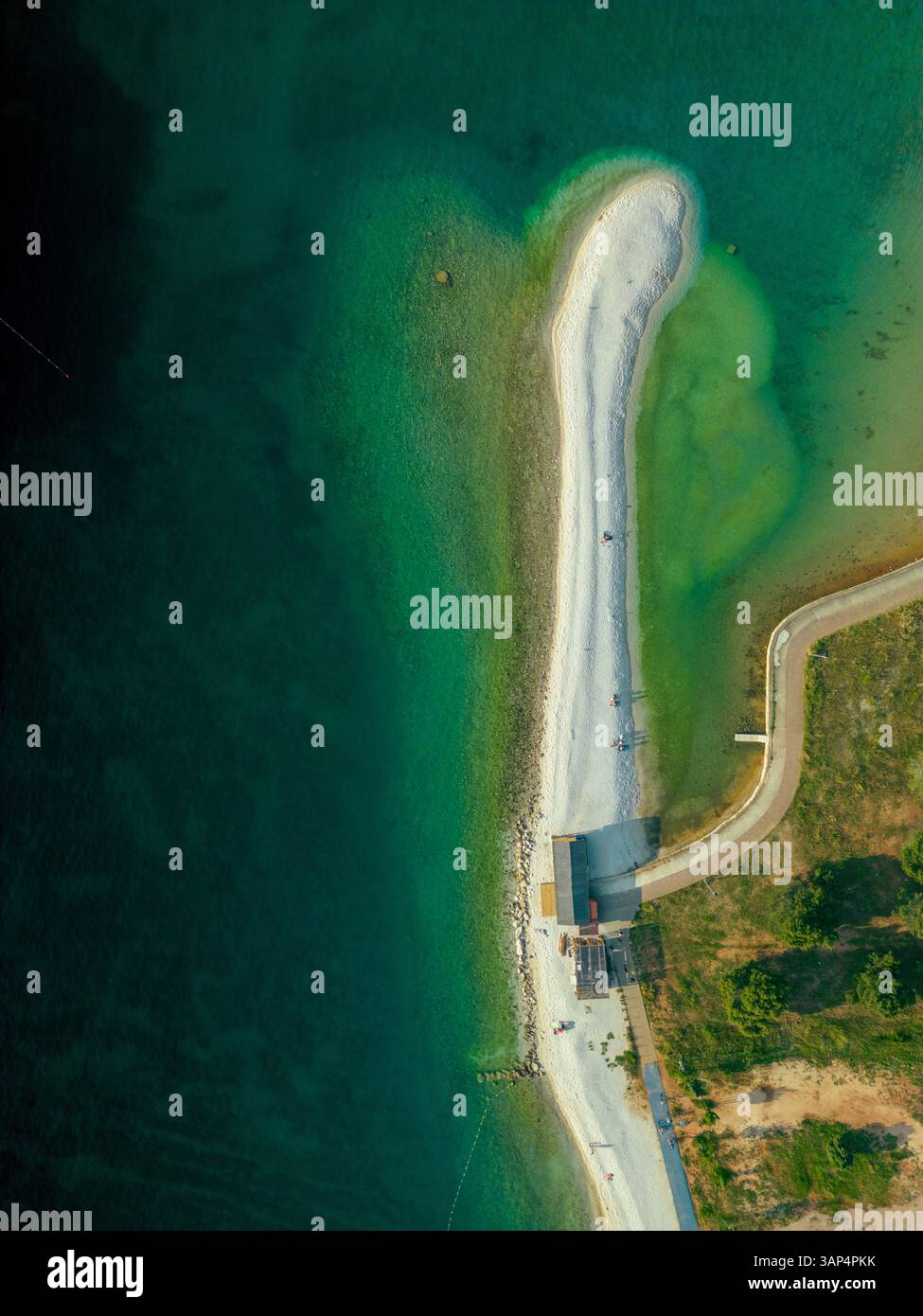 Aerial view of a small bar and restaurant on the beach along the coast ...