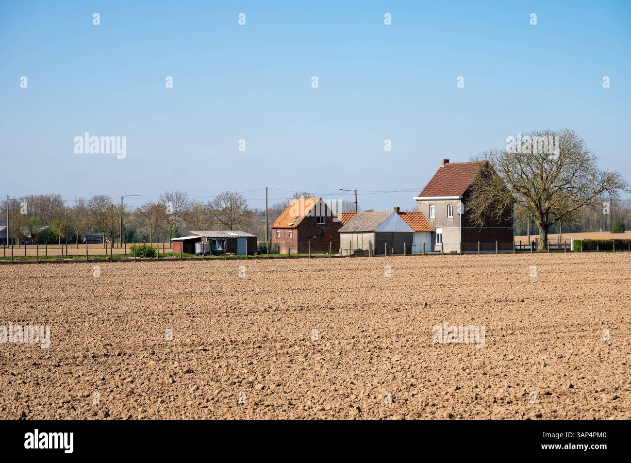 Brown soil of cultivated agriculture fields at the Flemish countryside ...