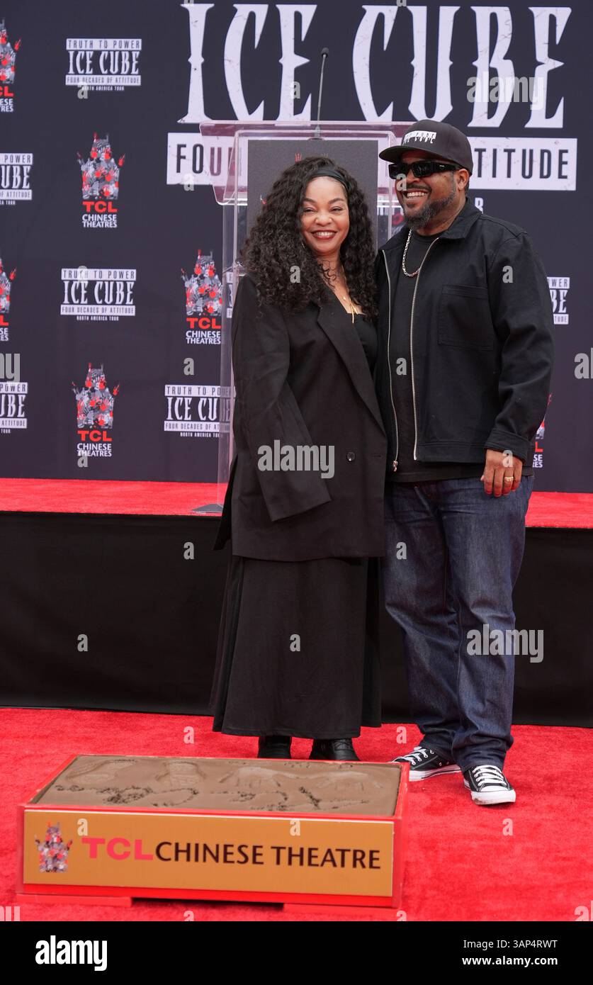 Ice Cube, right, and his wife Kimberly Woodruff pose together during a ...