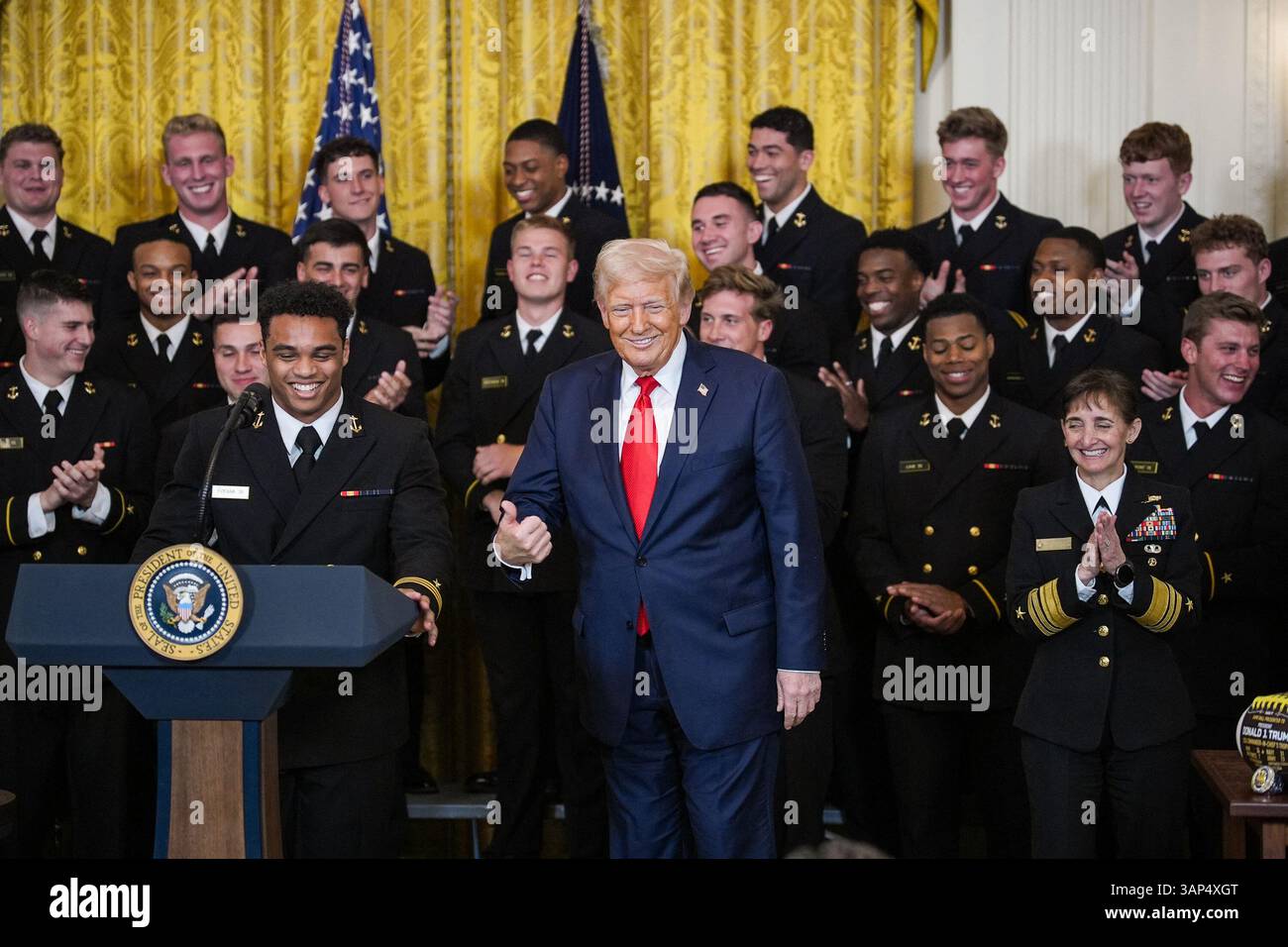 Daba Fofana stands at the podium next to US President Donald Trump at ...