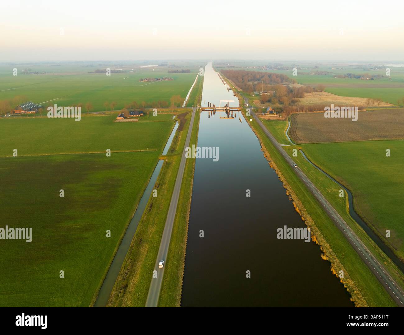 Aerial view of canal Eemskanaal, countryside, road and bridge ...