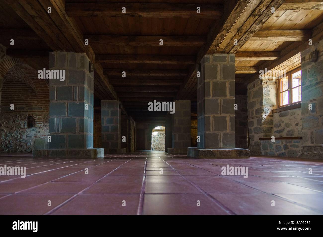 Inside a hallway of the Monastery of the Holy Trinity at Meteora with ...