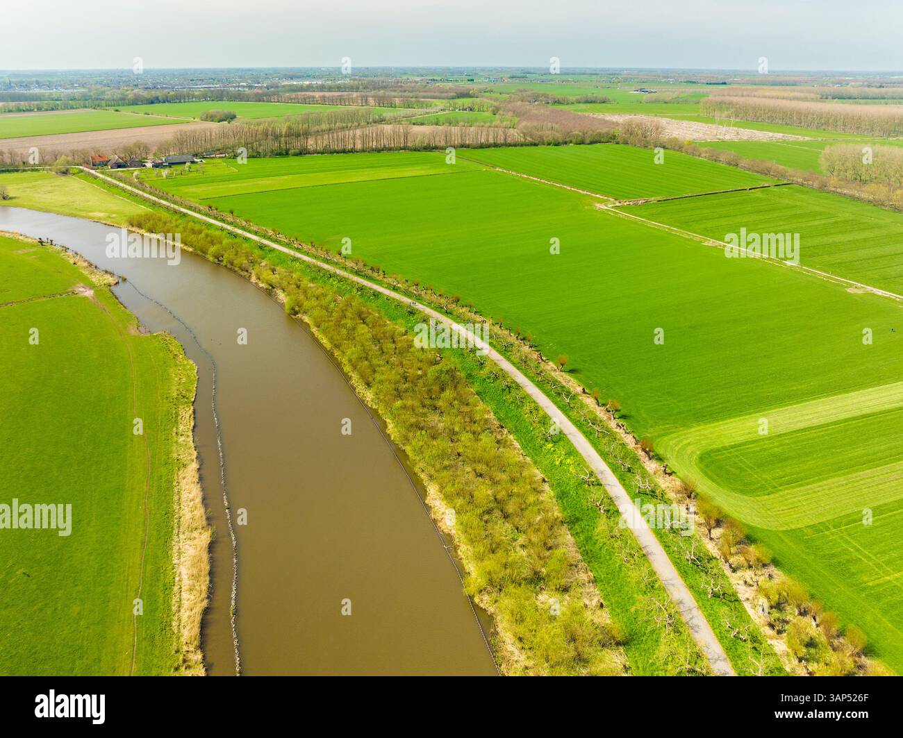 Aerial view of river Linge and bicycle path with apple trees ...
