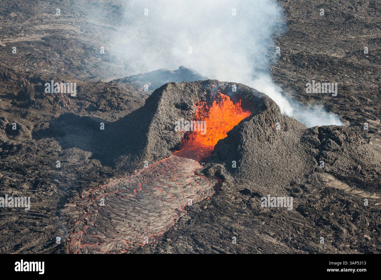 Aerial view of small crater with spewing lava during the largest ...
