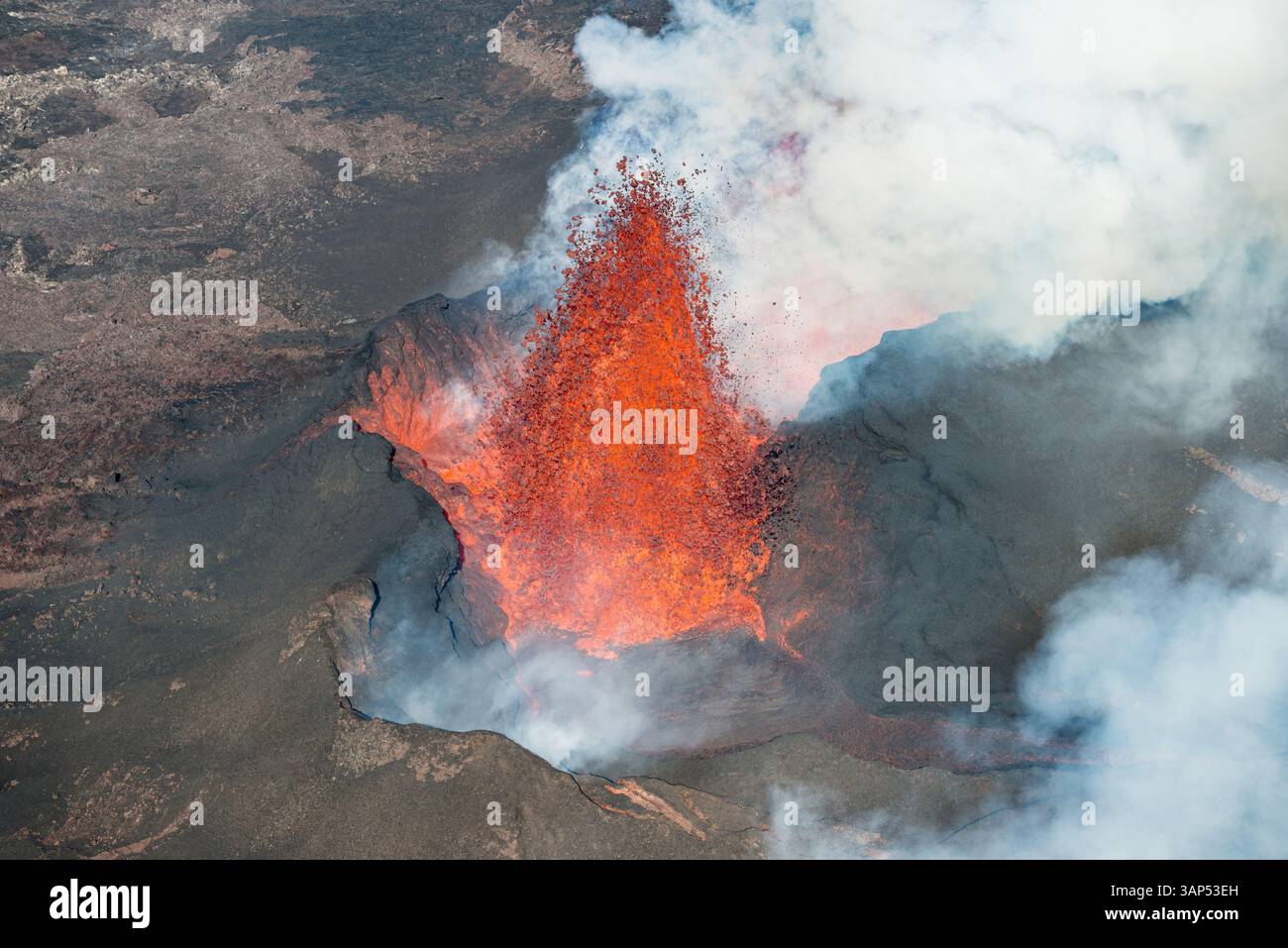 Aerial view of crater with spewing lava, smoke and gases during the ...