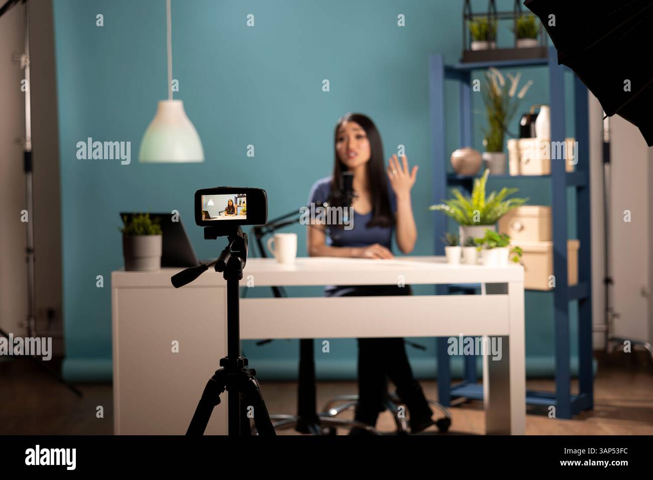 Social media influencer creating a review video in a professional ...