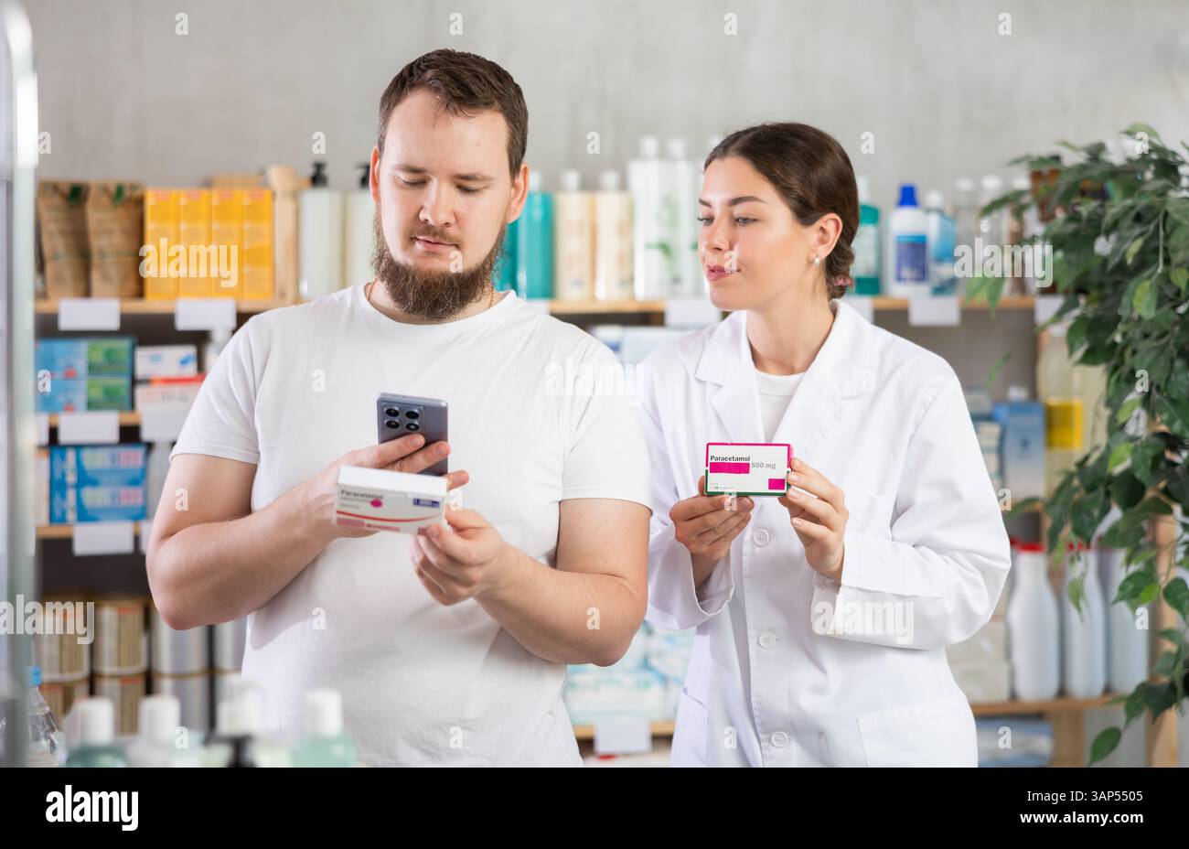 Man buyer scans paracetamol qr code with woman pharmacist Stock Photo ...