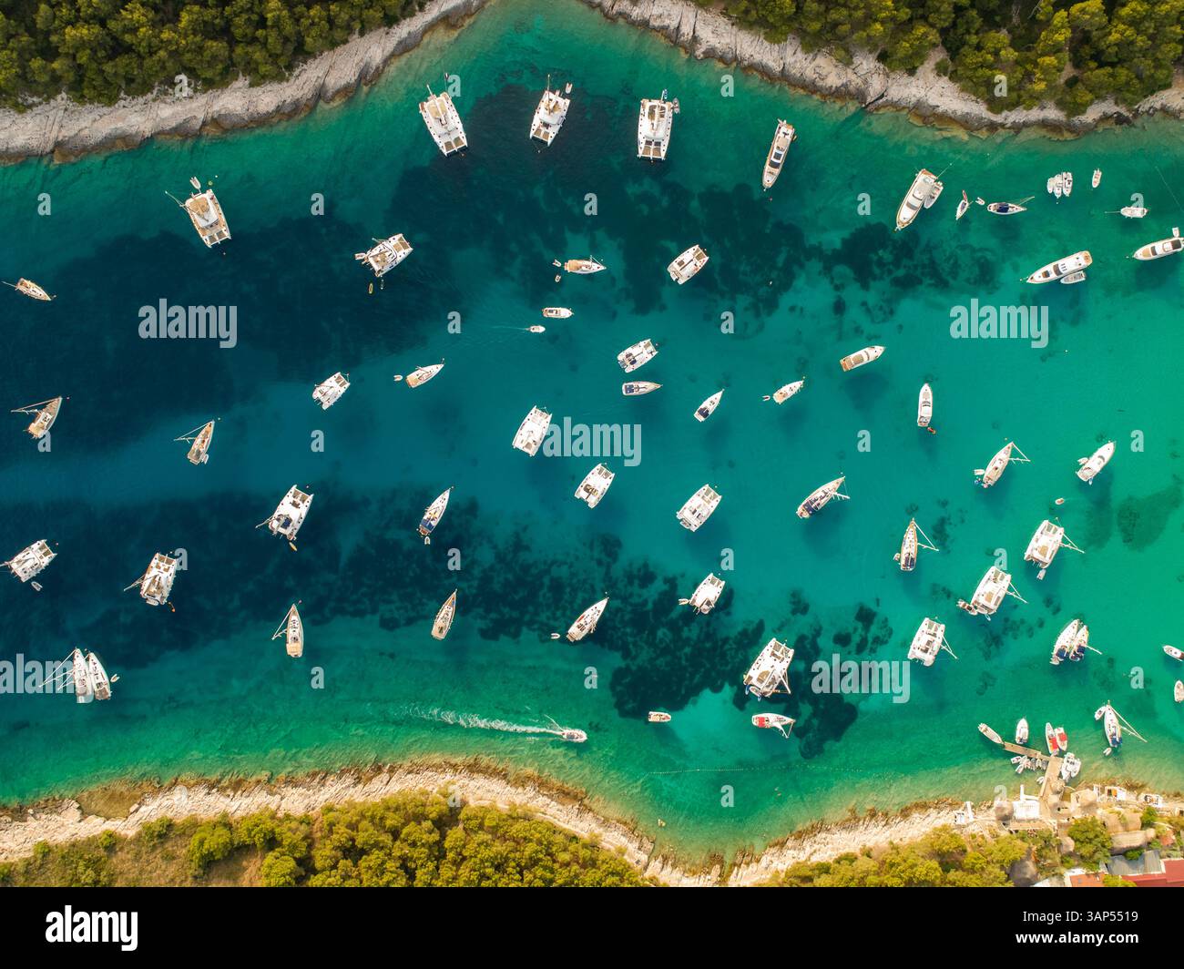 Aerial view of many luxury boats anchored in Palmizana bay, Hvar island ...