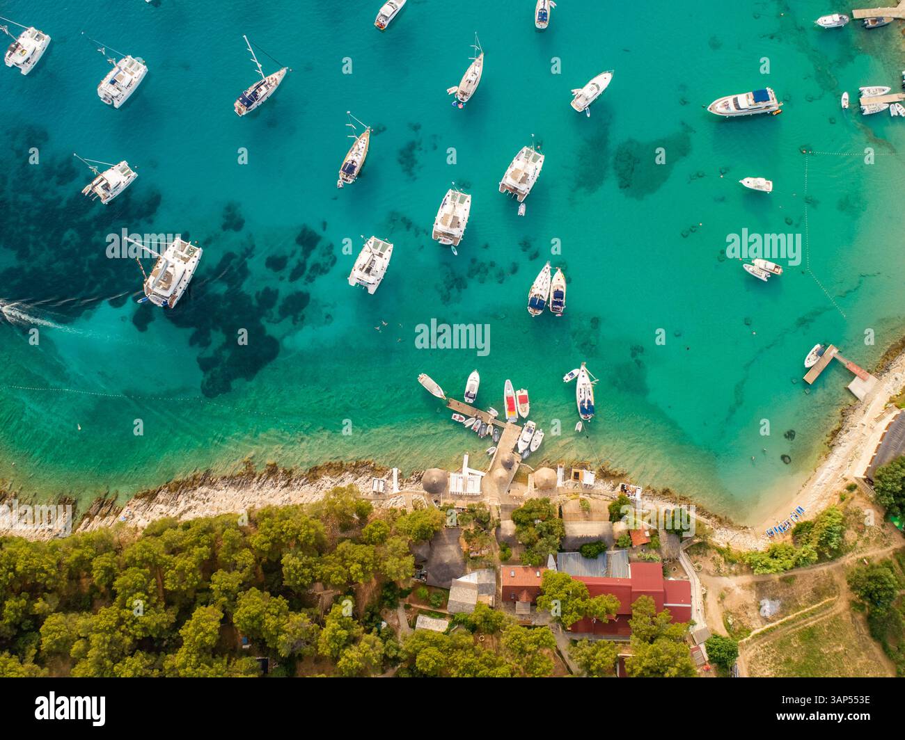 Aerial view of many luxury boats anchored in Palmizana bay, Hvar island ...