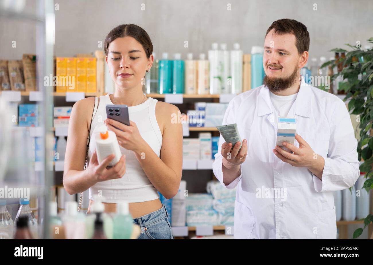 Woman scans QR code on skin creamp label. Male pharmacist offers to ...