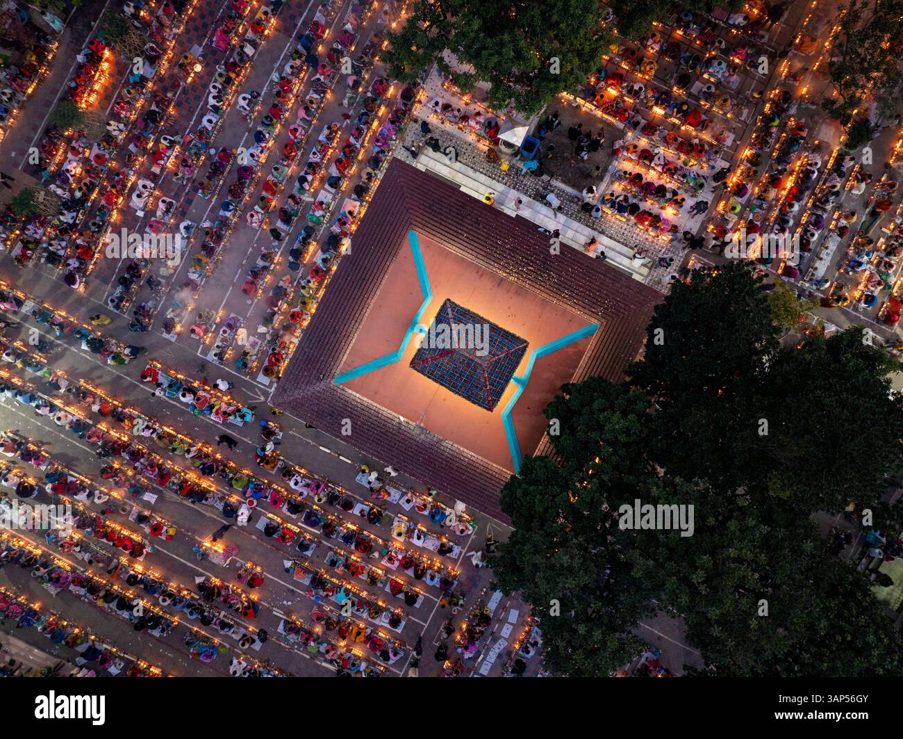 Aerial view of urban city Dhaka at night with lit up mosques and ...